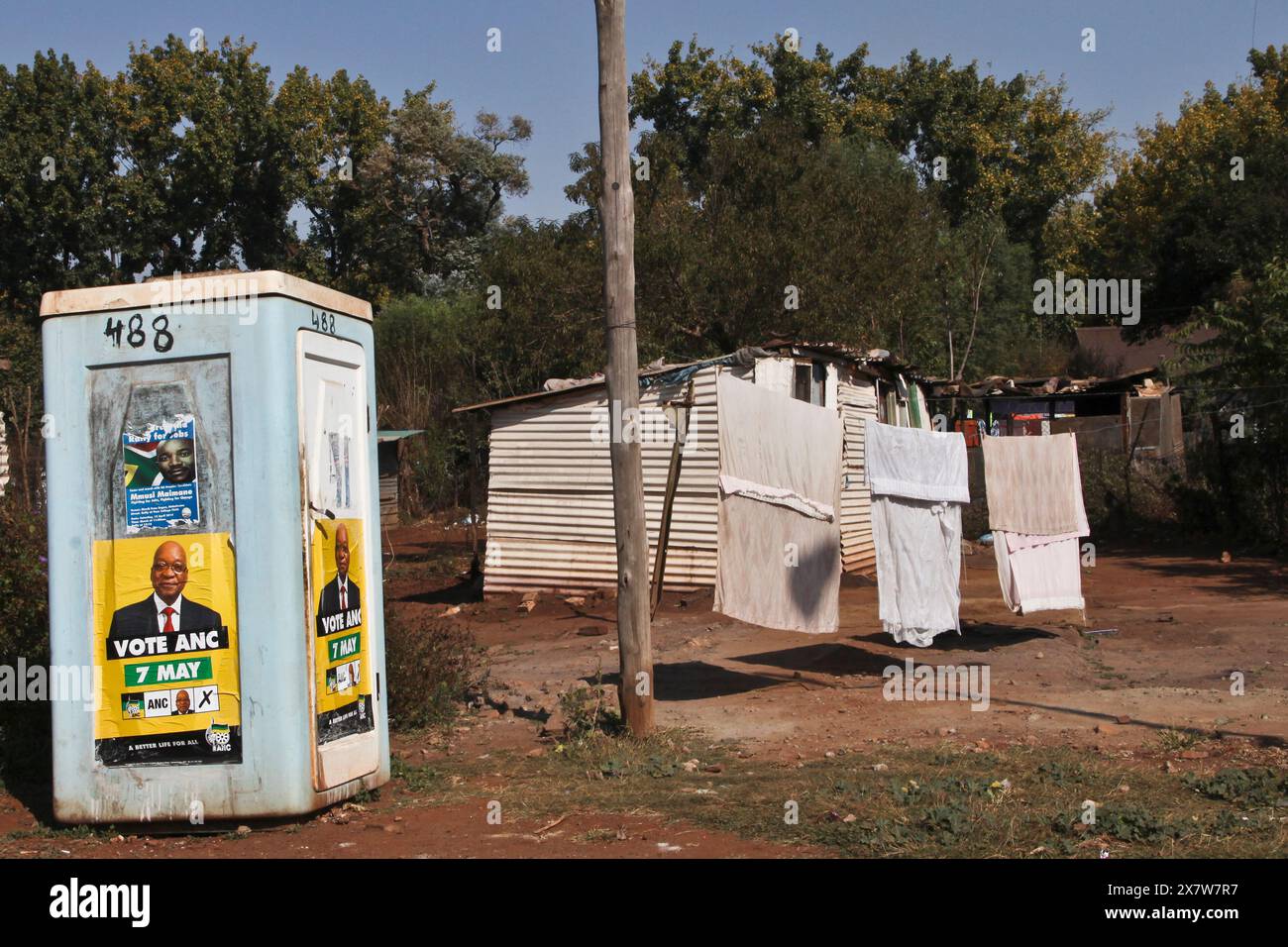 3 May 2014 - ANC and DA election posters on a toilet among shacks and ...