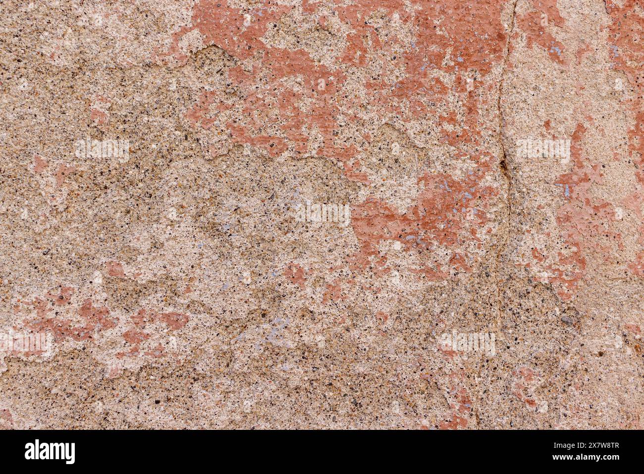 Old plaster coming off and showing concrete wall. Close-up of a ...