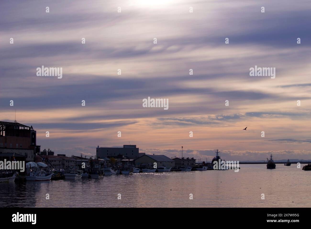 Beautiful scenery in Japan Kushiro Port at dusk and a small fishing ...