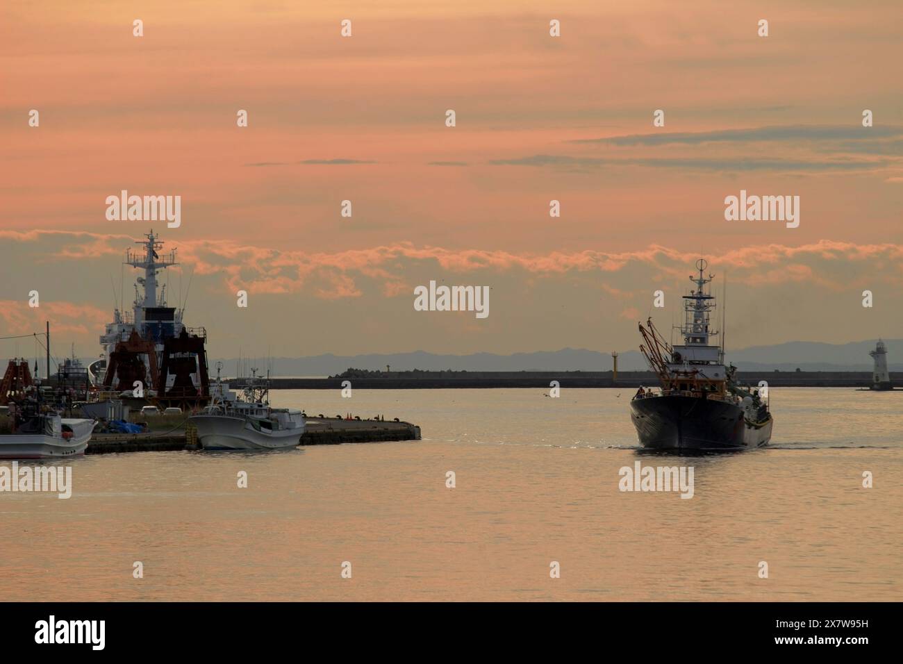 Beautiful scenery in Japan Kushiro Port at dusk and a small fishing ...