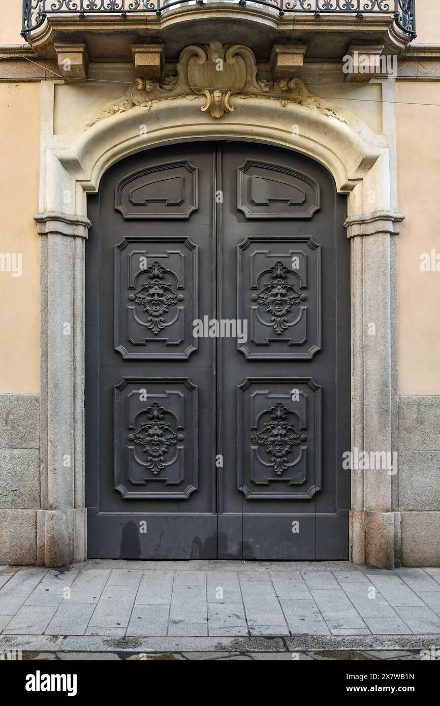 Entrance gate decorated with heads of satyrs or demons of Palazzo ...