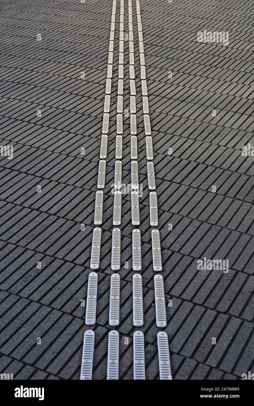 A close-up photo of a visually impaired person's guide block installed ...