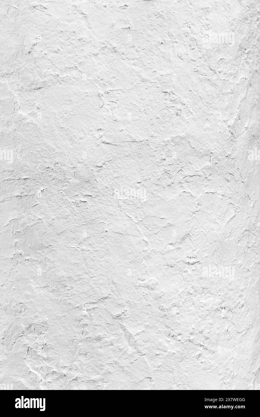 White wall with decorative relief stucco layer, vertical background ...