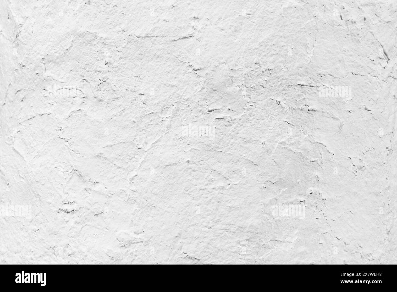 White wall with decorative relief stucco layer, close-up background ...