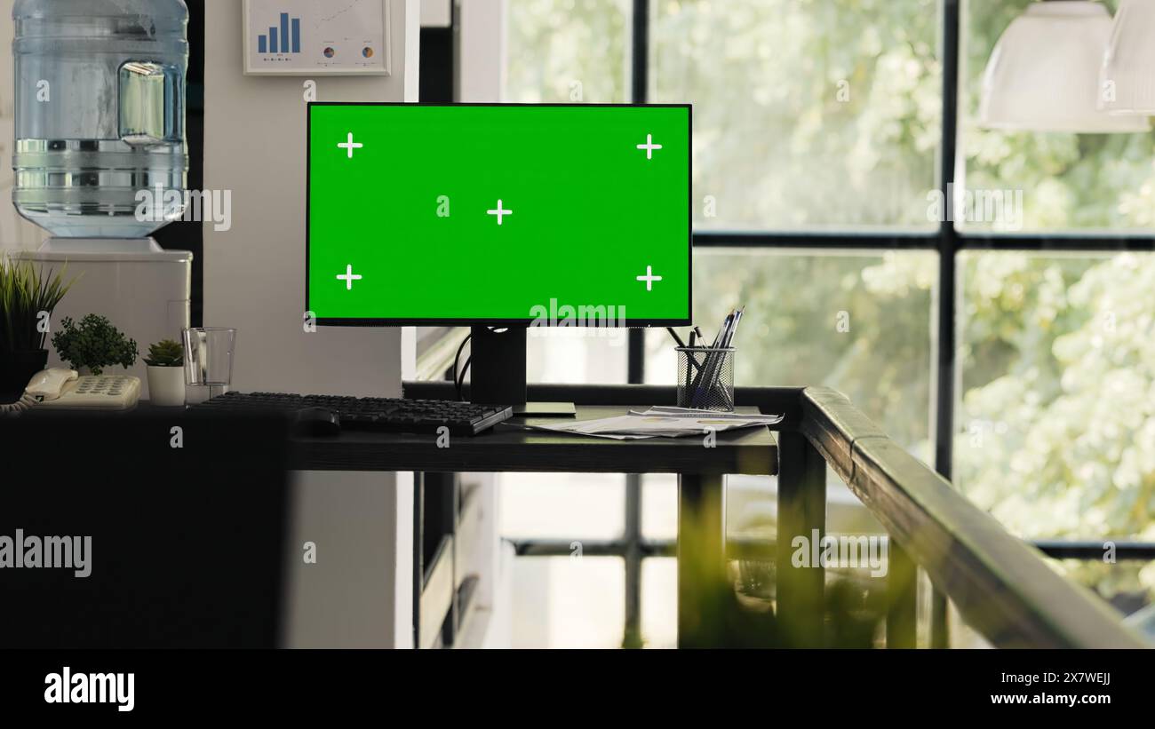 Empty desk with greenscreen layout presenting blank copyspace template ...