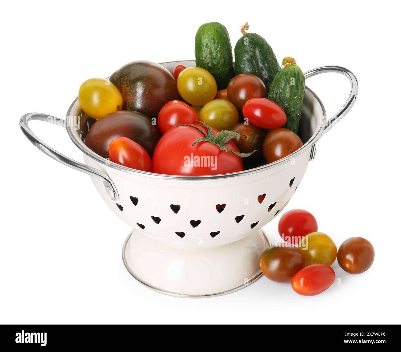 Metal colander with different tomatoes and cucumbers isolated on white ...