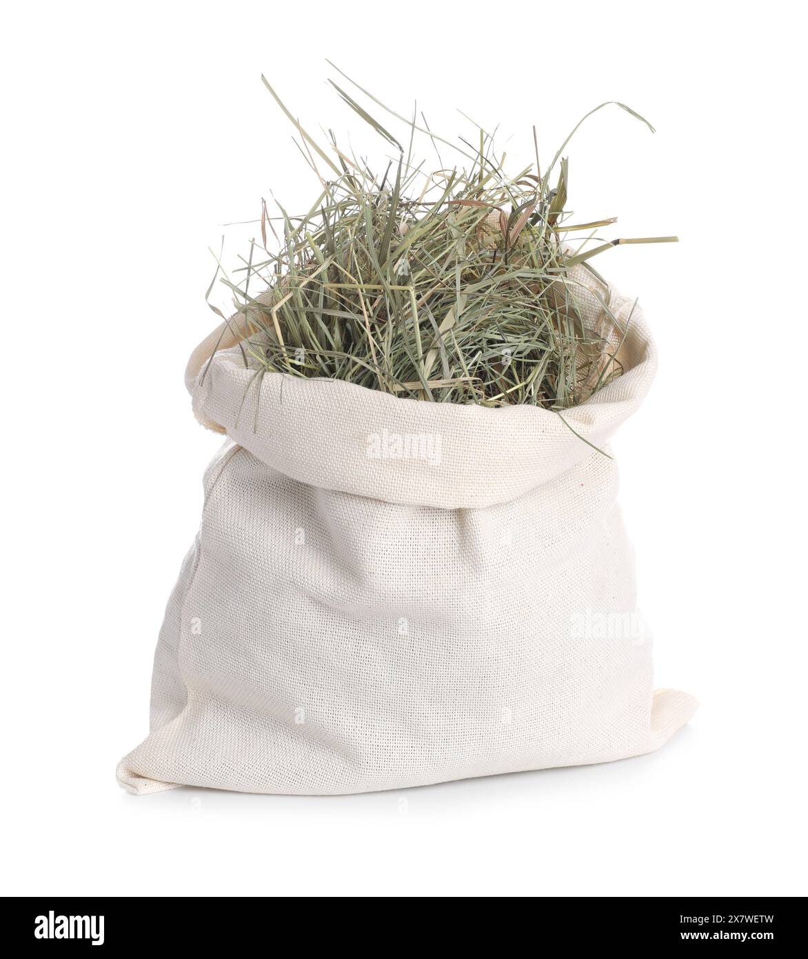 Dried hay in burlap sack isolated on white Stock Photo - Alamy