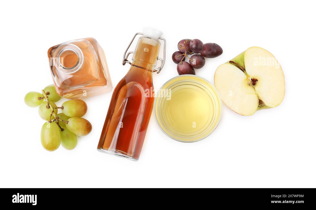 Different types of vinegar and ingredients isolated on white, top view ...