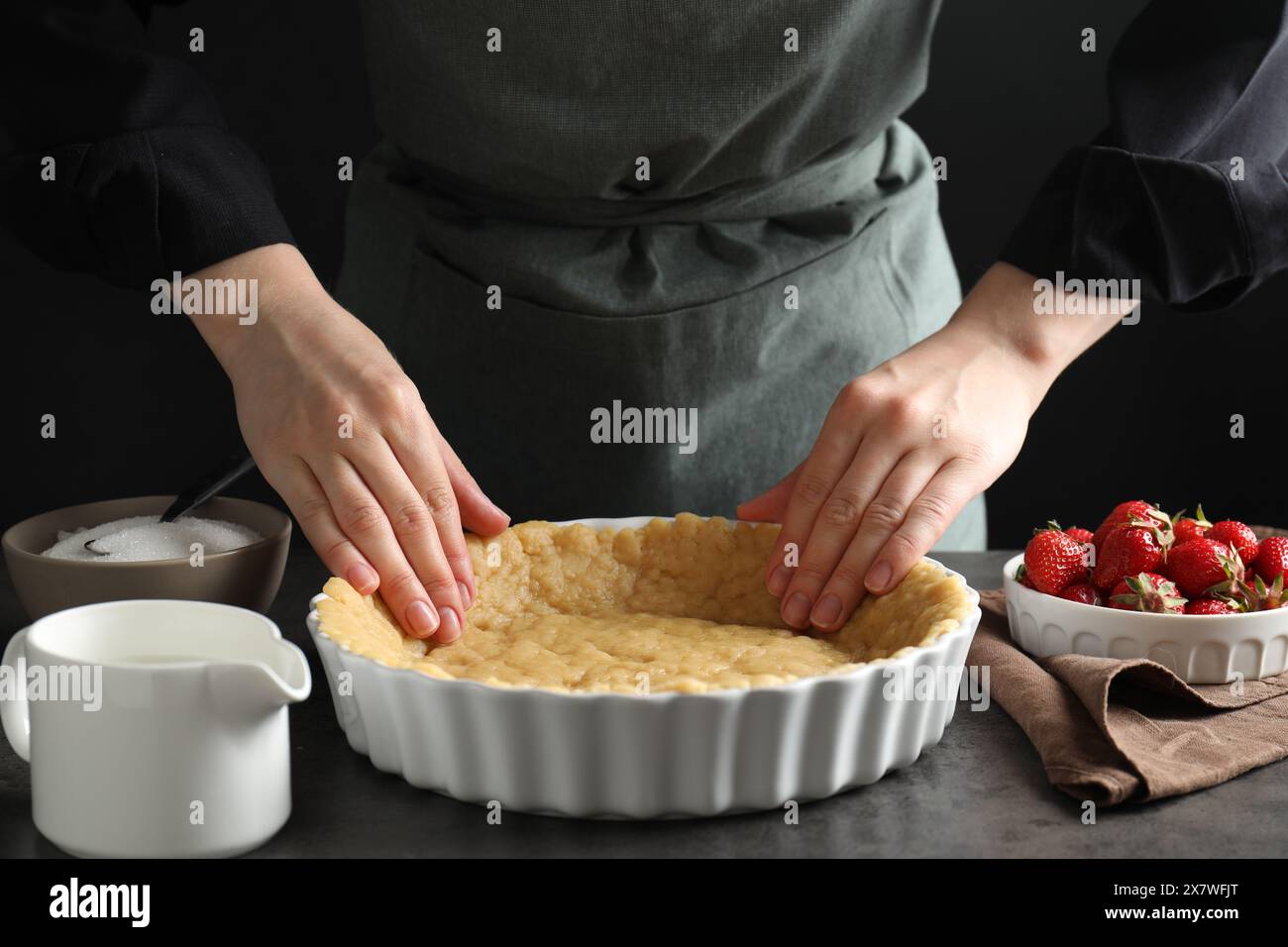 Shortcrust pastry. Woman making pie at grey table, closeup Stock Photo ...