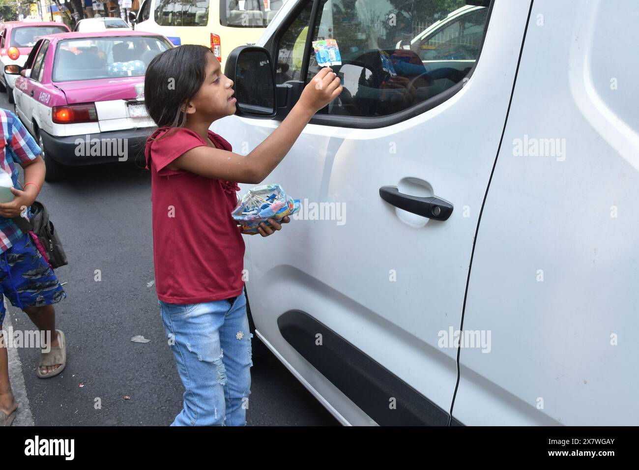 A Venezuelan migrant girl from an encampment in the Misterios ...