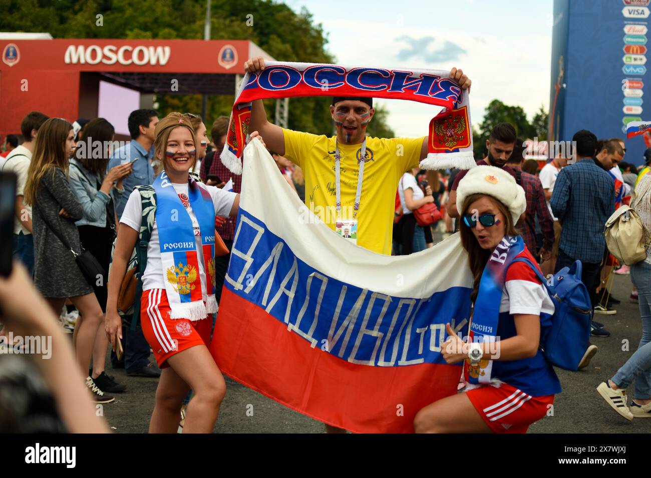 Group of people taking fun photos with the Russian flag and their faces ...