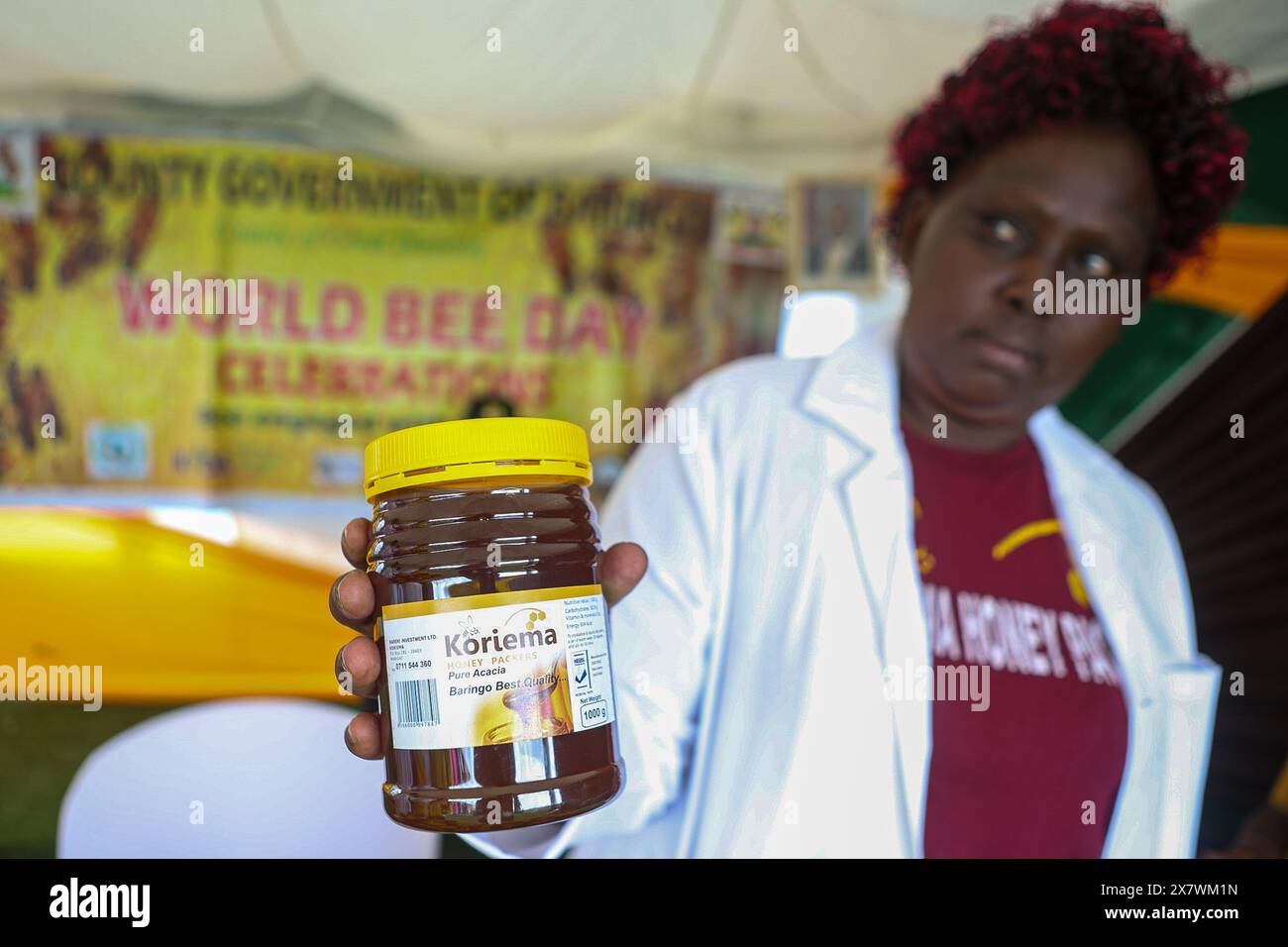 A local bee keeper from Baringo county, in Kenya showcases honey has ...