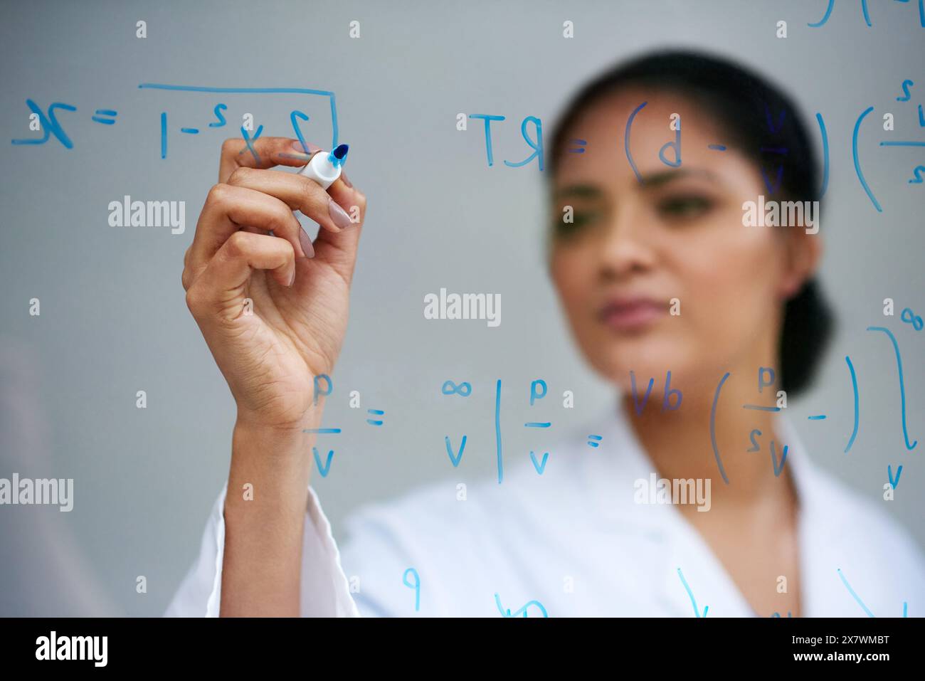 Hand, problem solving and science on glass with woman in studio on gray ...