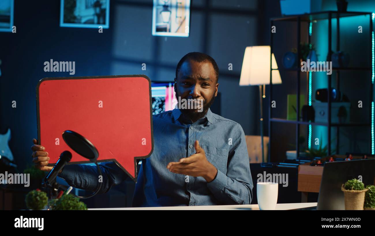Influencer filming sponsored content, holding empty copy space sign in ...