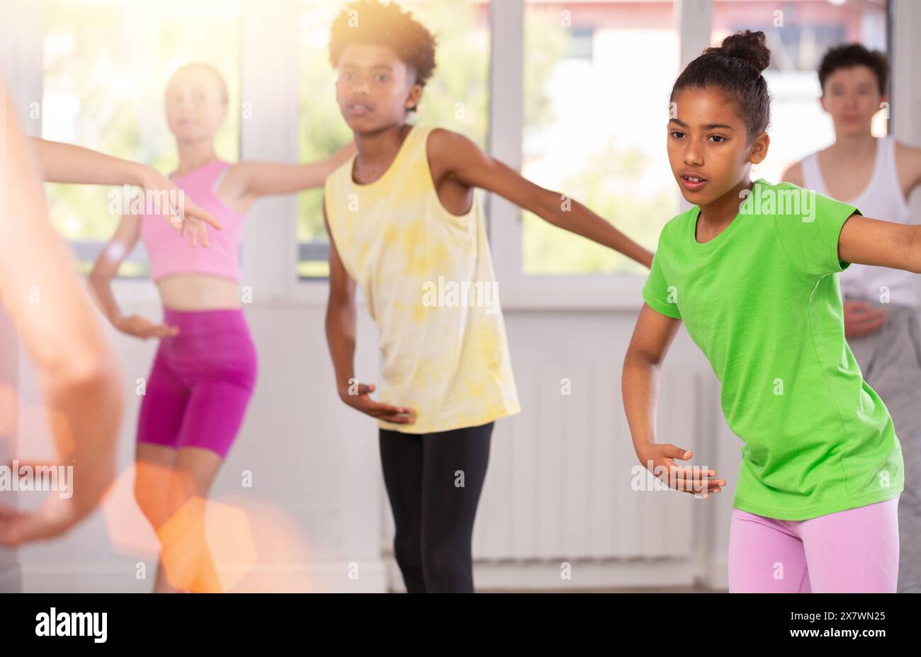 Group of teenage dancers training ballet in studio Stock Photo - Alamy