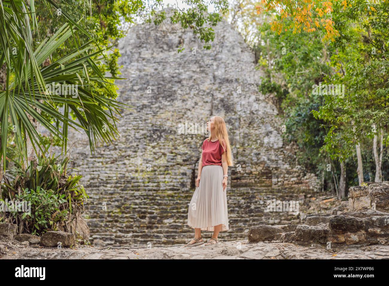 Woman tourist at Coba, Mexico. Ancient mayan city in Mexico. Coba is an archaeological area and ...
