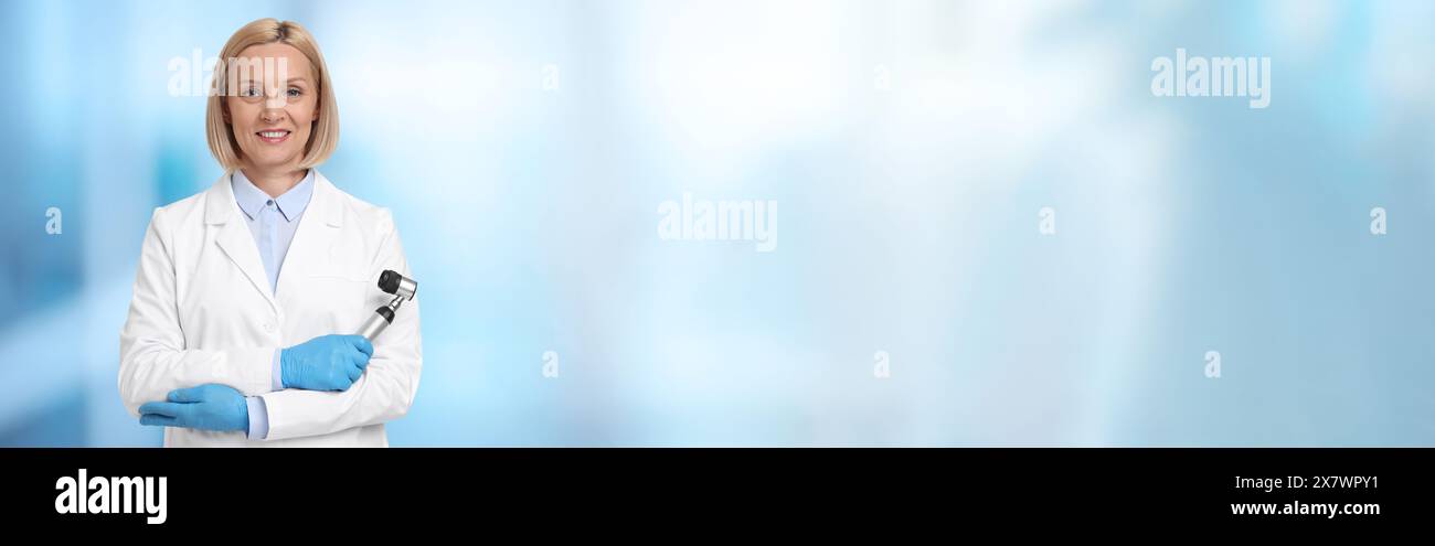 Professional dermatologist with dermatoscope on blurred background ...