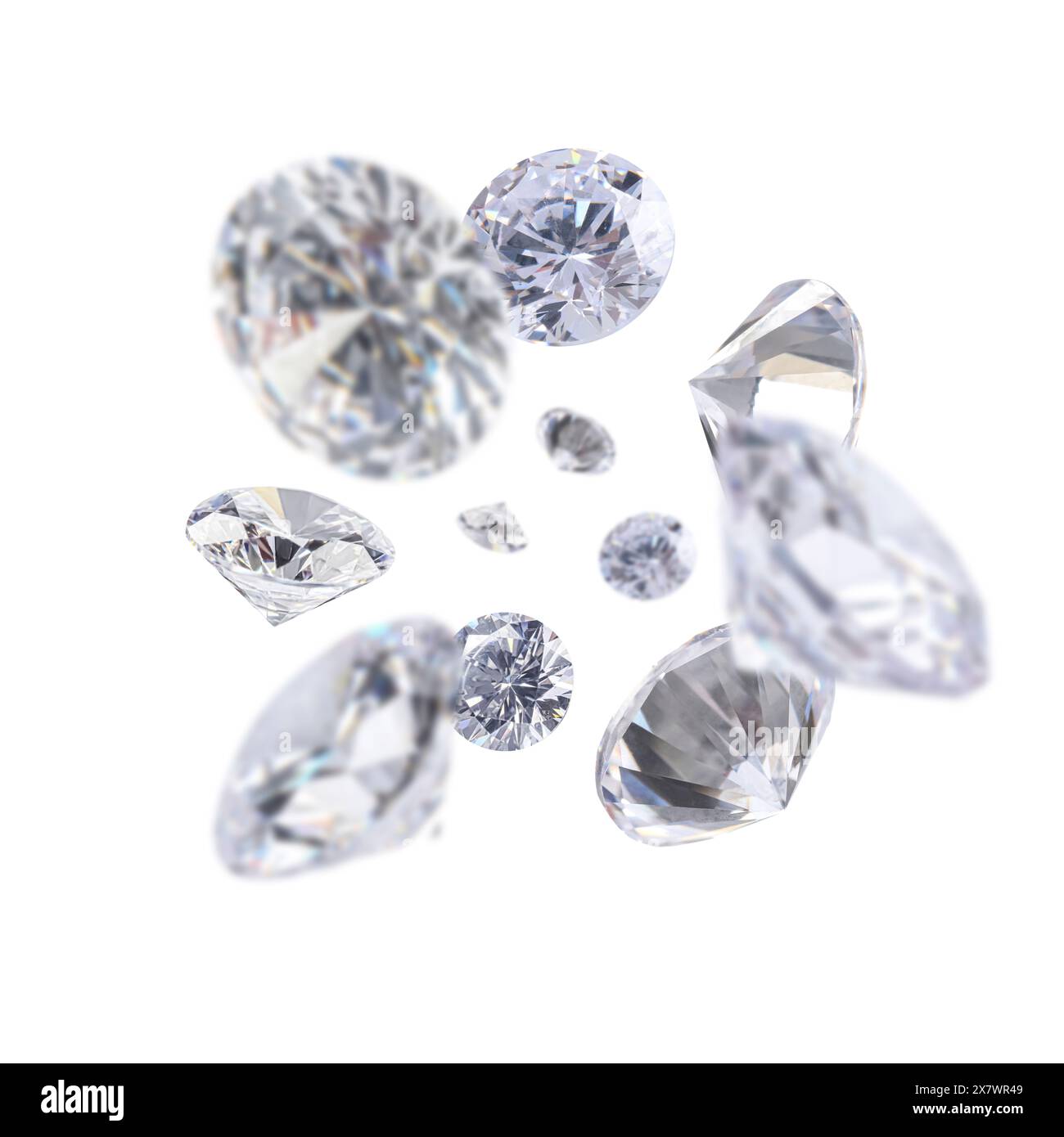 Beautiful shiny diamonds in air on white background Stock Photo - Alamy