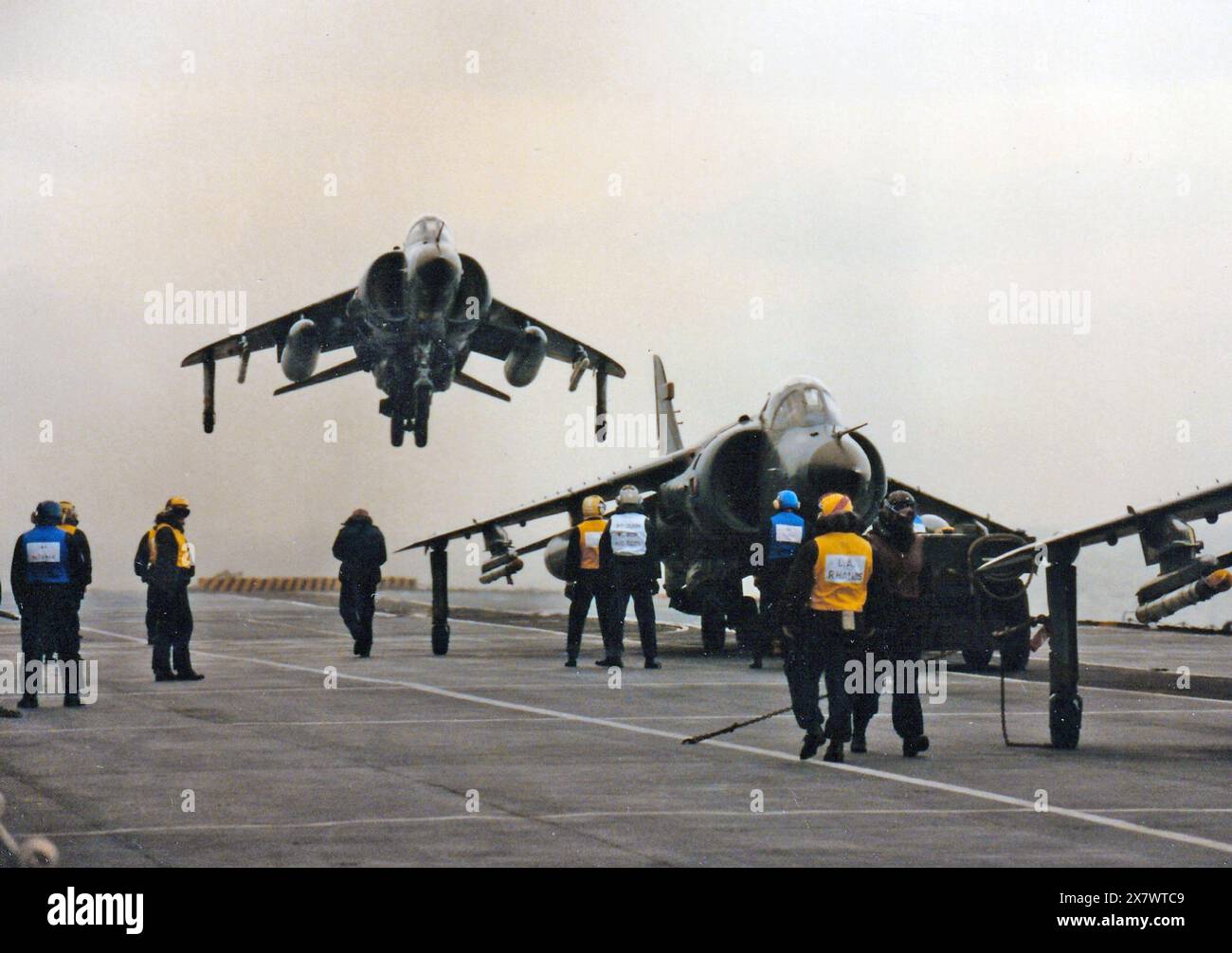 NAVAL HARRIER JUMP JETS LAND ON AIRCRAFT CARRIER HMS INVINCIBLE, 1990 ...