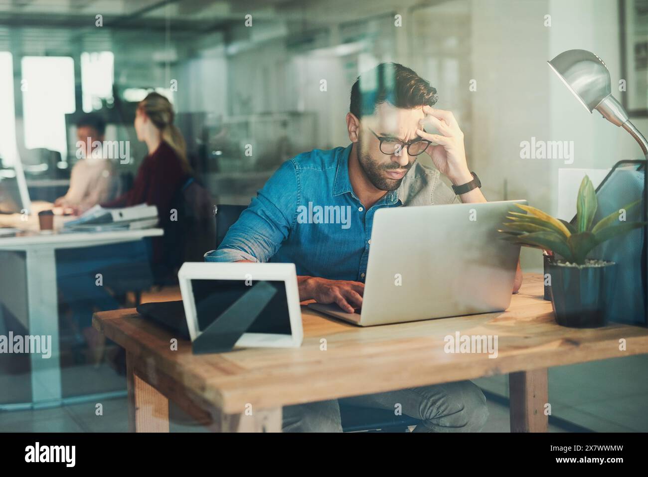 Office, stress and businessman with laptop for writing article and ...