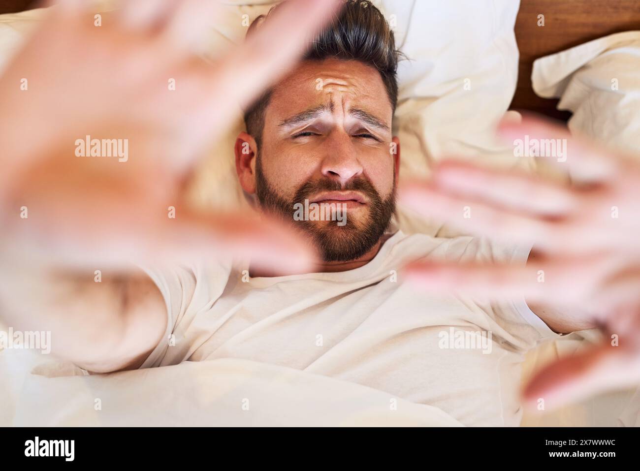 Above, man and bedroom with hands, portrait and waking up in morning ...