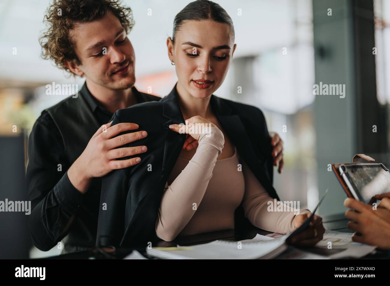 Young business couple collaborating on a project in a modern office ...