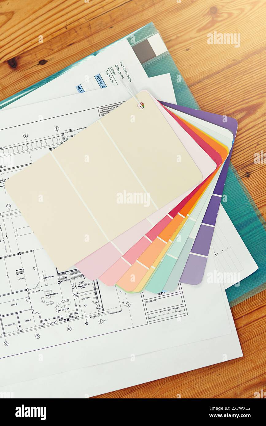 Color, swatch and planning home renovation with blueprint on table from ...