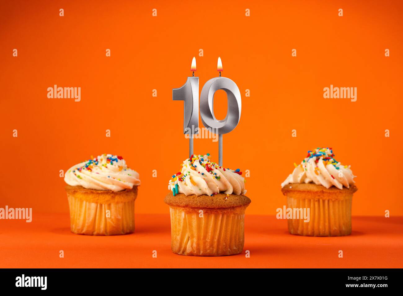 Birthday celebration in orange color - Candle number 10 Stock Photo - Alamy