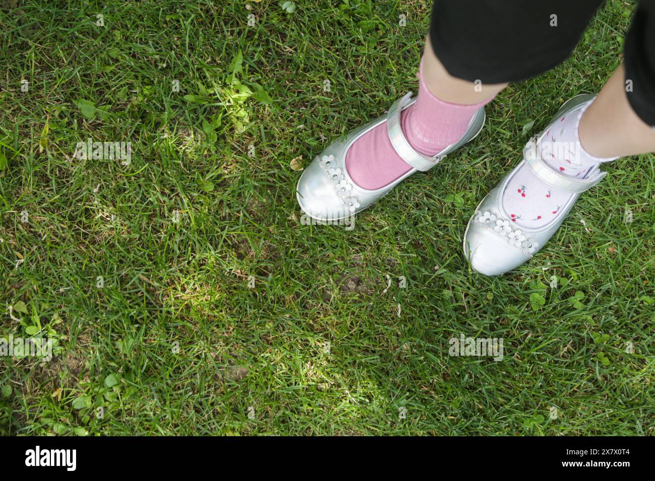 Kid wears different pair of socks. Child foots in mismatched socks ...