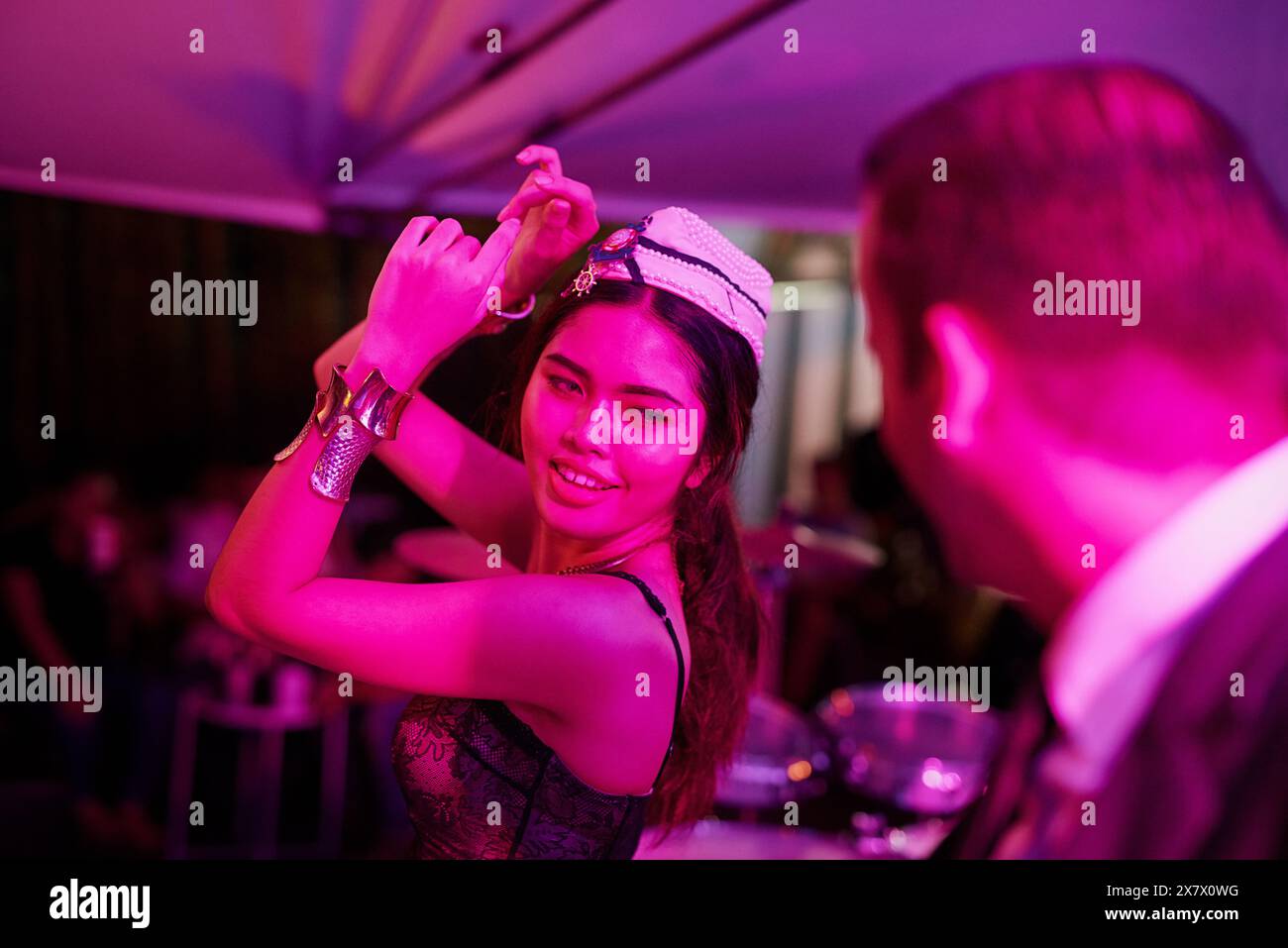 Music, dance and Asian woman in nightclub with lights at disco event ...