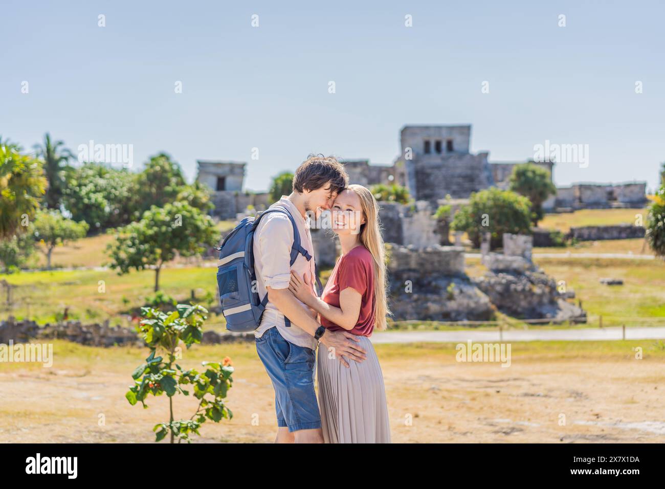 Couple man and woman tourists enjoying the view Pre-Columbian Mayan ...