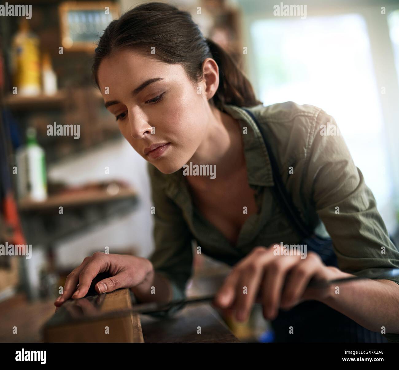 Woman, carpenter and measuring with builders square for planning, wood ...