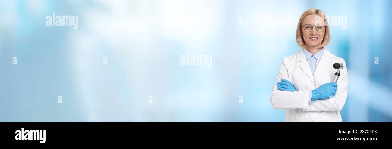 Professional dermatologist with dermatoscope on blurred background ...