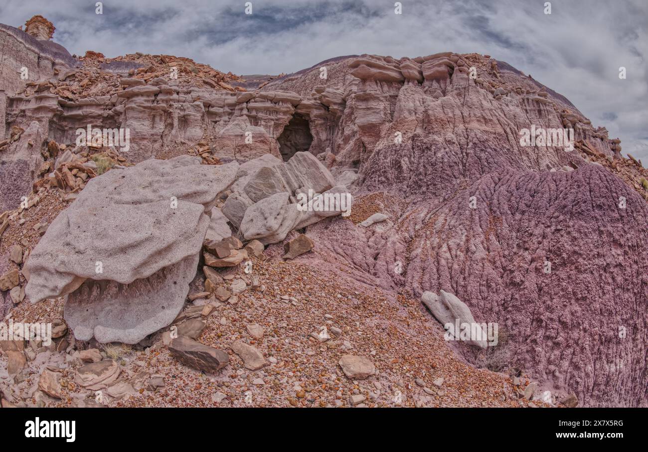A shallow waterfall cave carved from the bentonite cliff below the ...