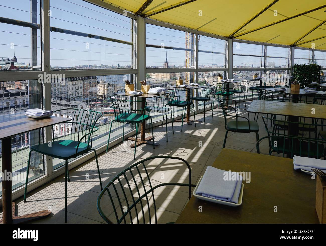 the inside of a restaurant with view over a city Stock Photo - Alamy
