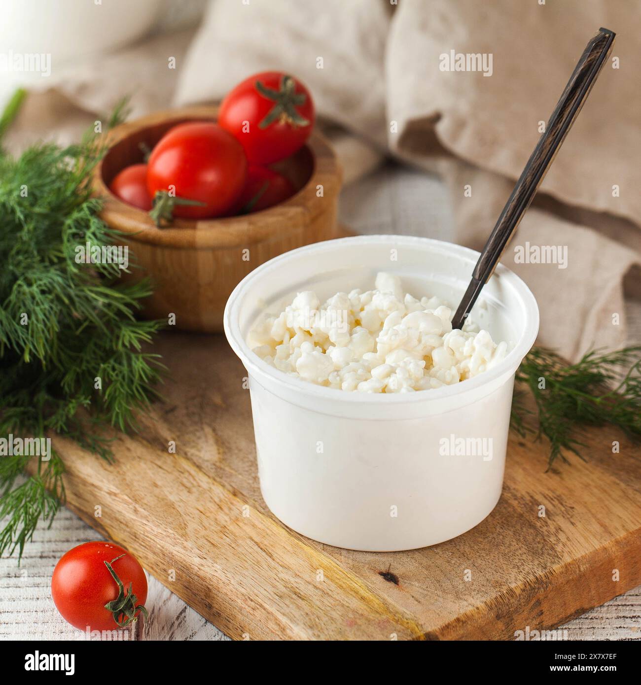 Fresh cottage cheese in a plastic ja for a healthy and nutritious ...