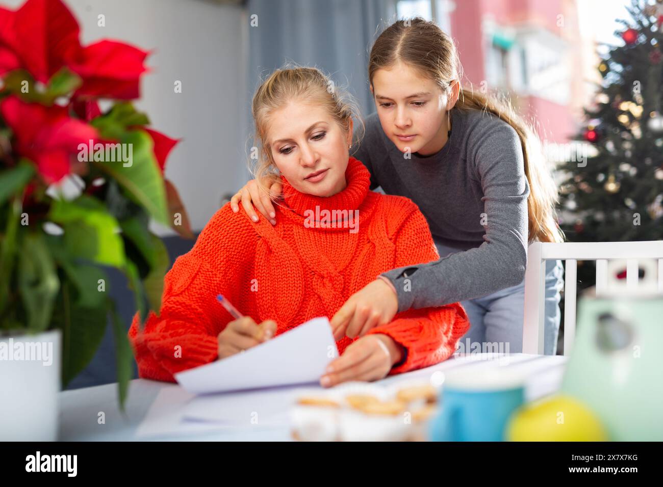 Woman and children check list hi-res stock photography and images - Alamy