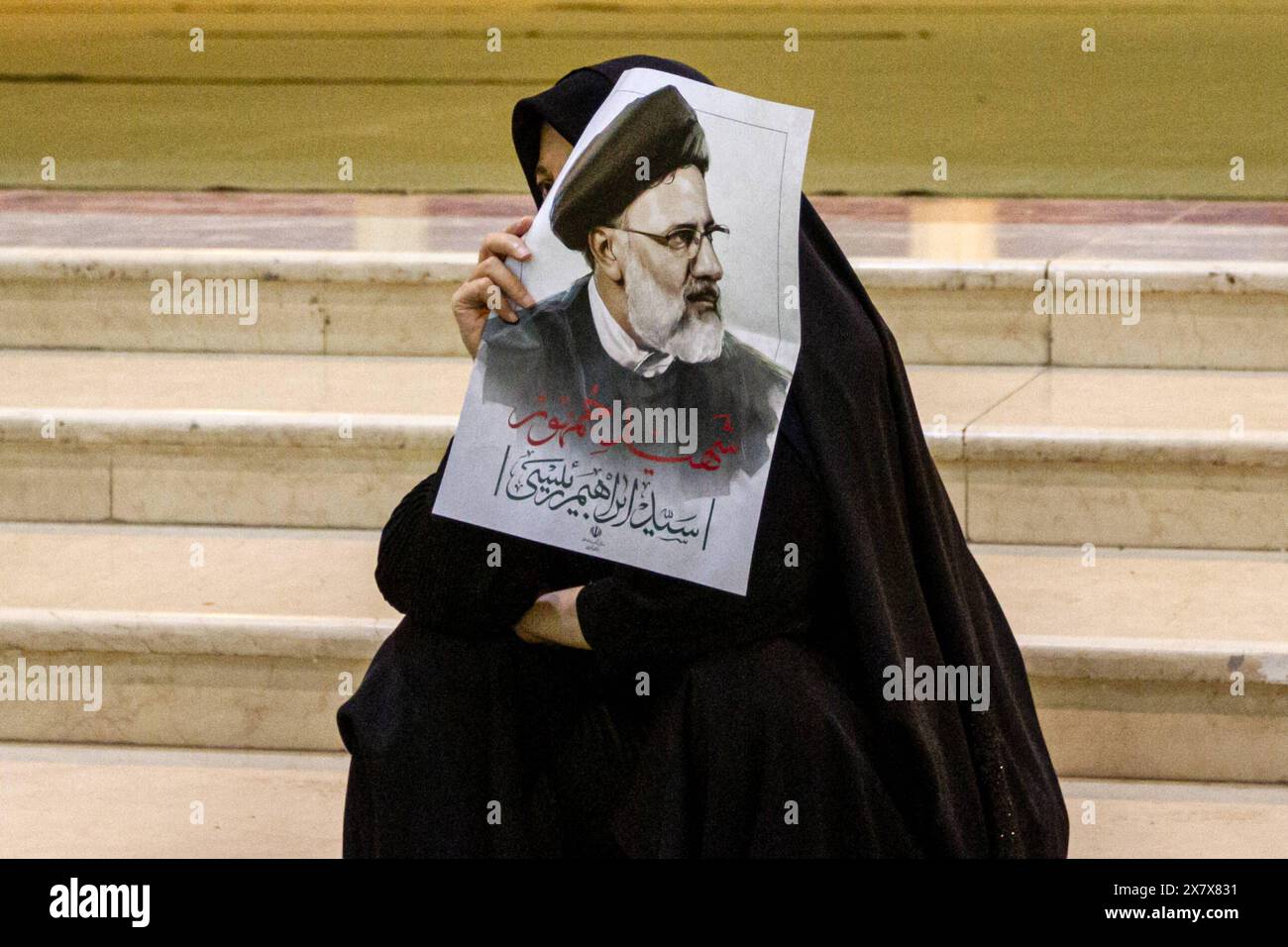 Iranian officials adjust the coffin of late President Ebrahim Raisi ...