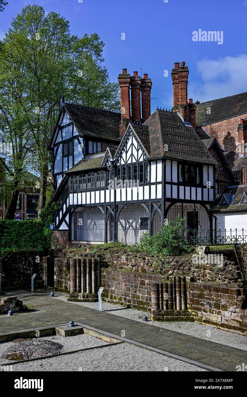 Lychgate Cottages, intact reminders of medieval priory, beside ruins of ...