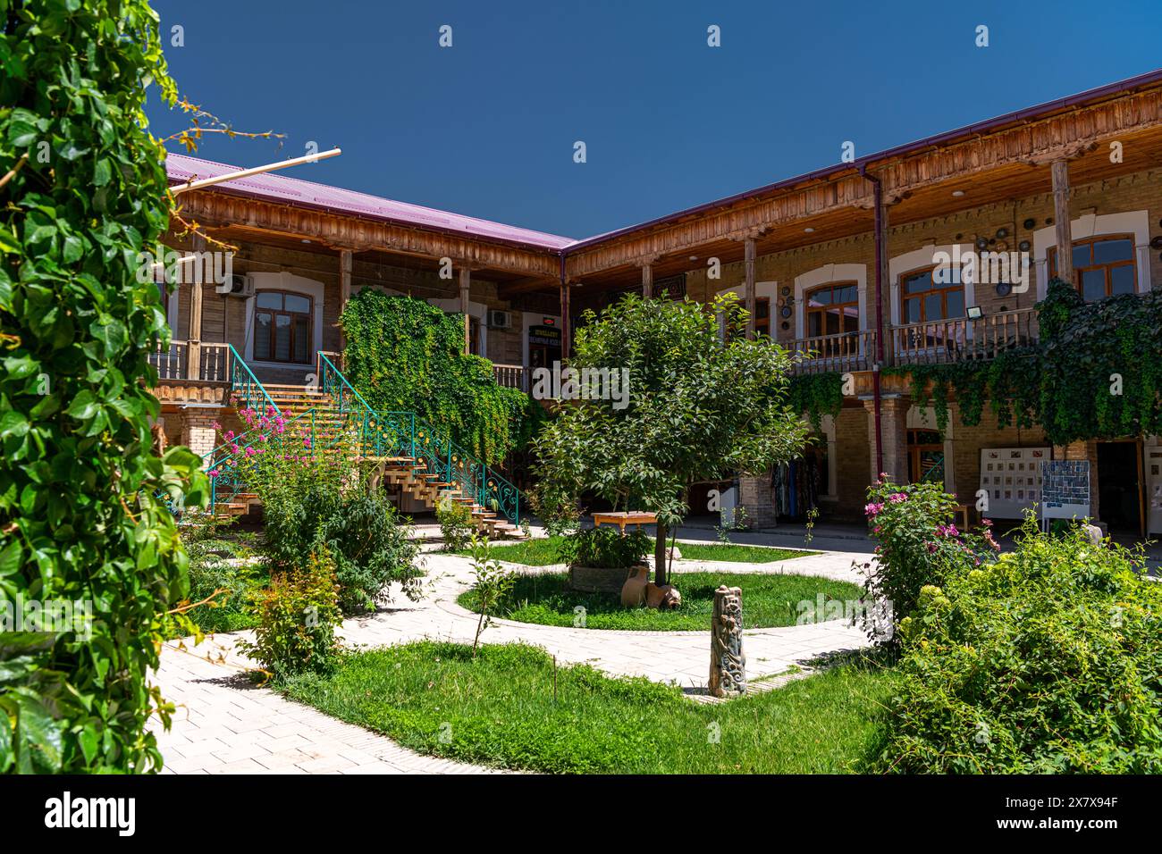 Backyard of the traditional uzbek house in Samarkand, Uzbekistan. Blue ...