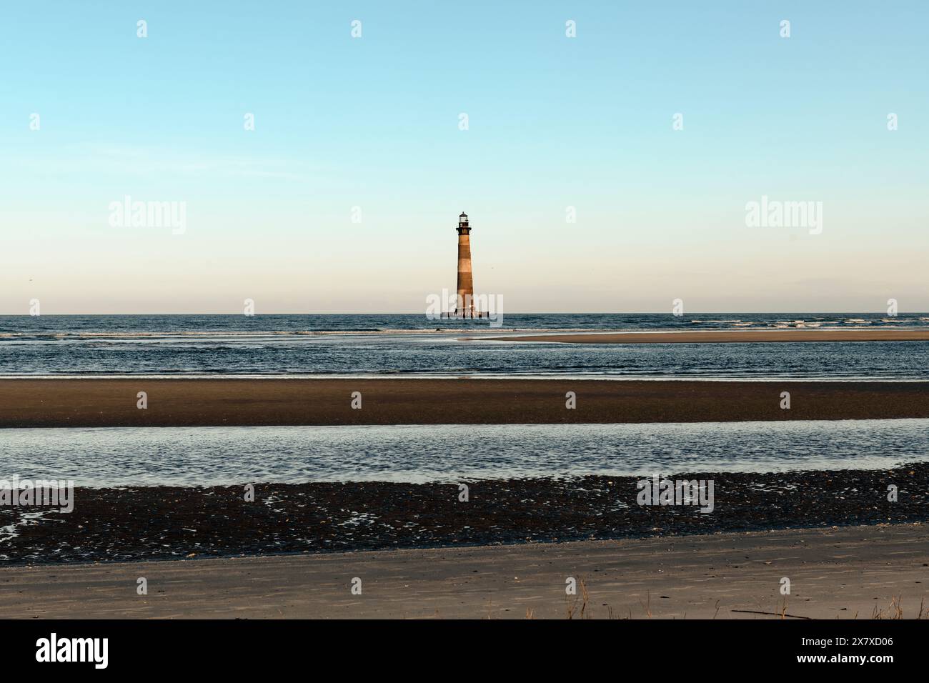Morris Island Lighthouse from the shoreline of Folly Beach near ...