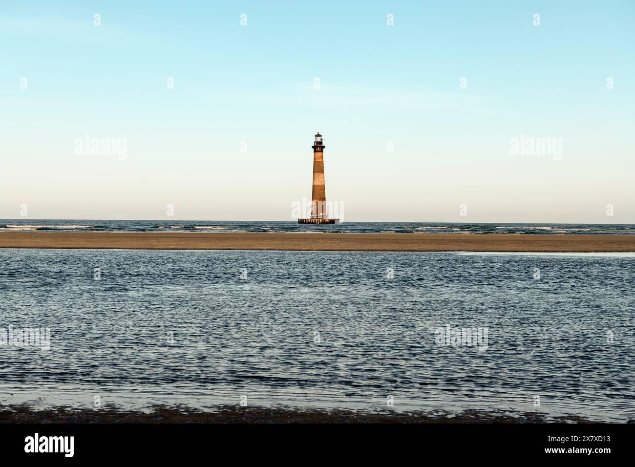 Morris Island Lighthouse from the shoreline of Folly Beach near ...