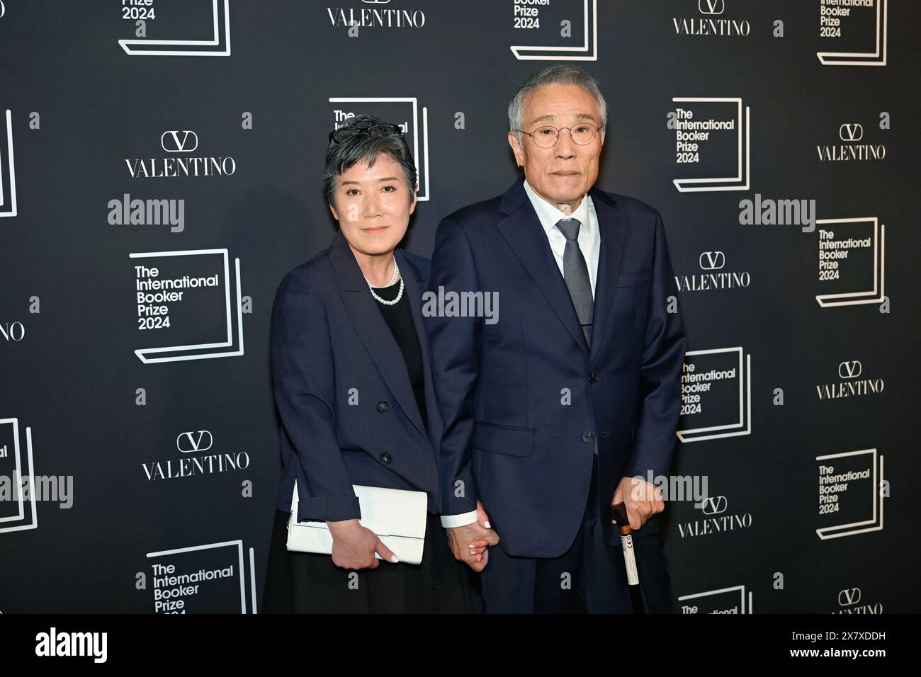 LONDON, ENGLAND - MAY 21 2024: Author Hwang Sok-yong (R) and guest with ...