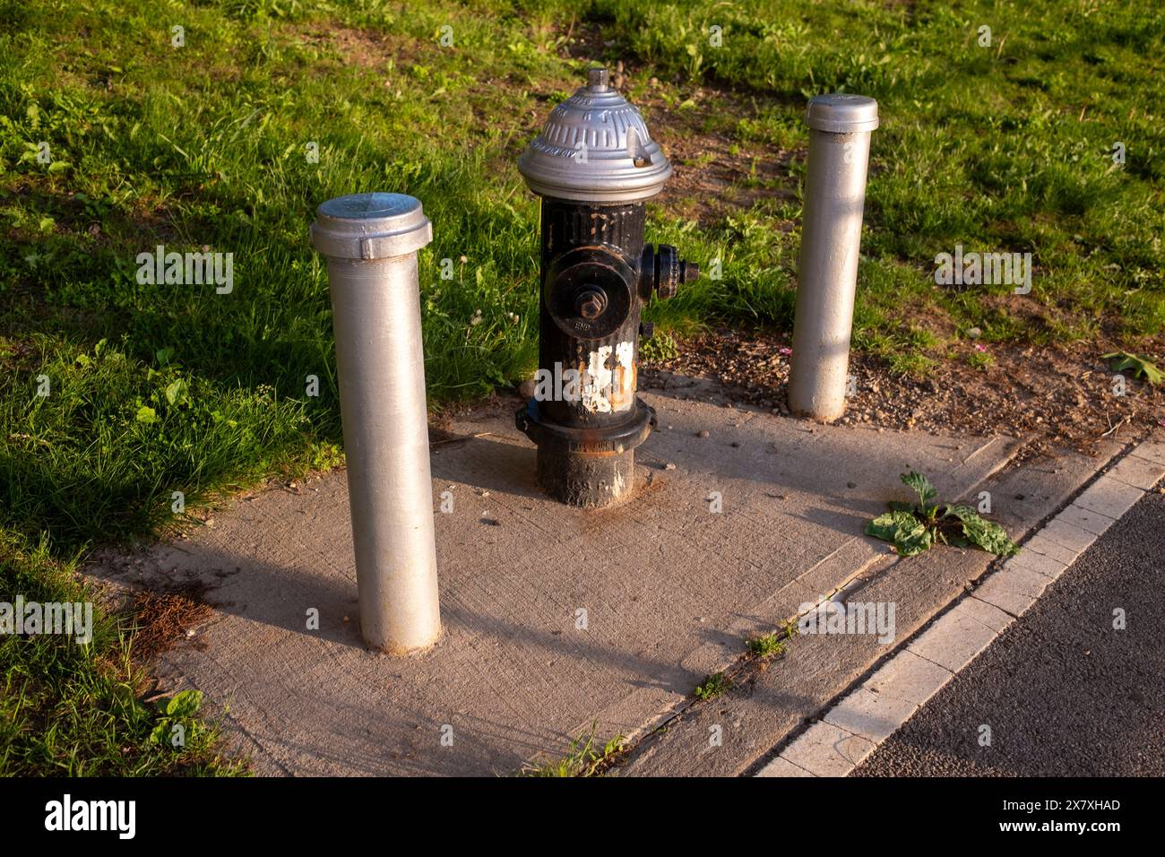 New York City Fire Hydrant, Black and Silver Top, on a sidewalk Stock ...