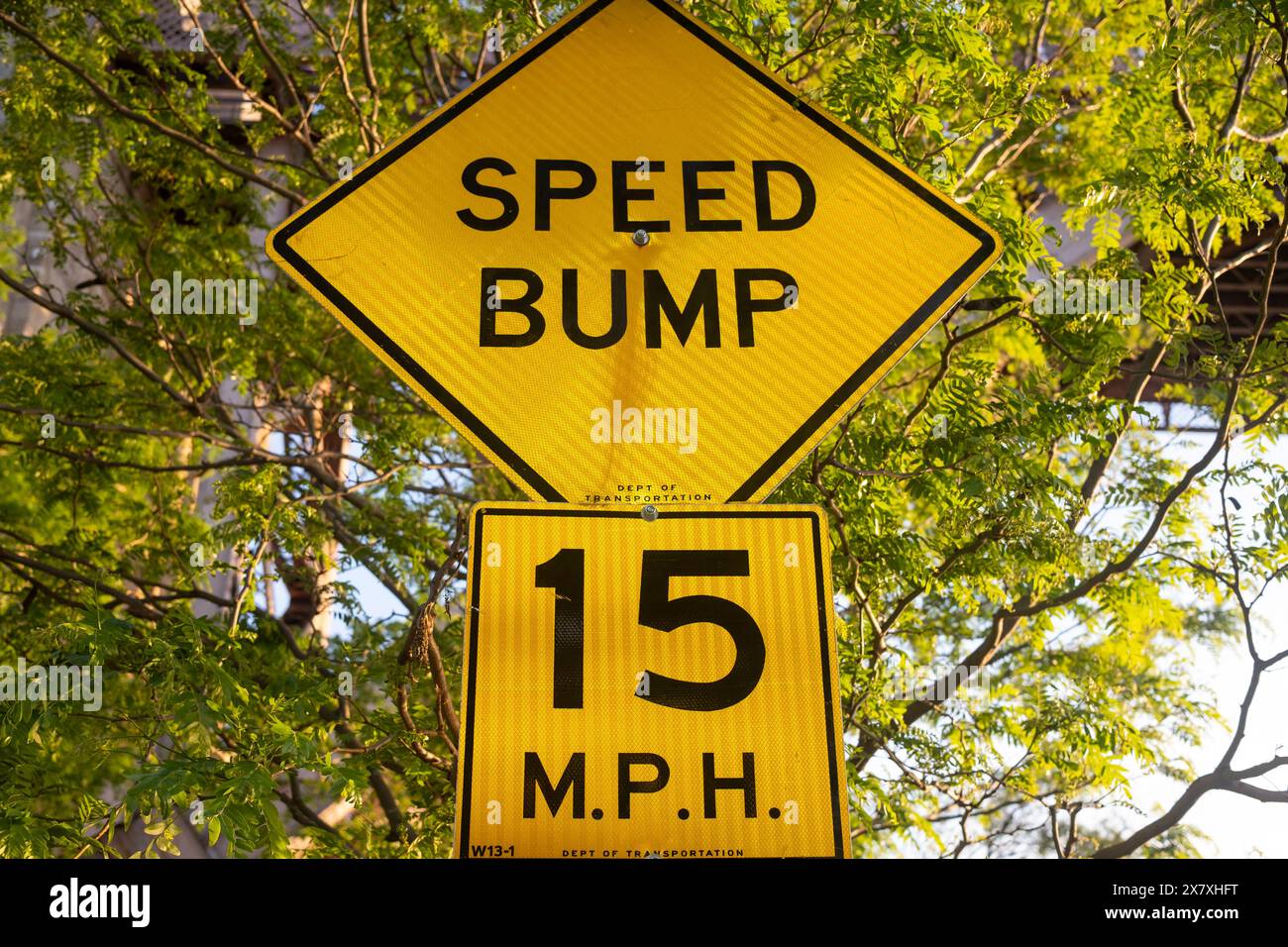 Traffic Sign Speed Bump Warning With Advisory Speed Signs Road Stock Photo - Alamy