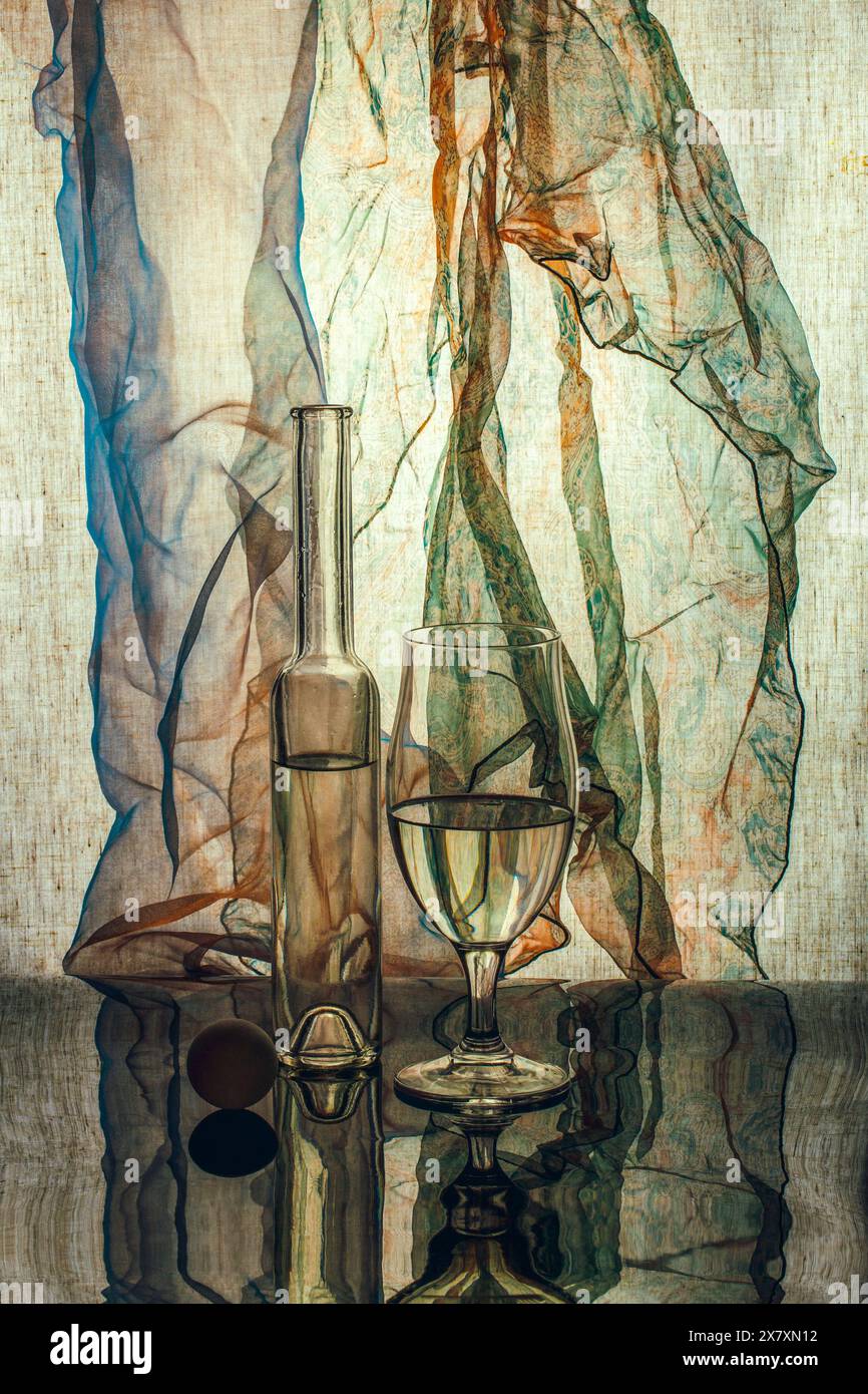 Still life with glassware and transparent cloth Stock Photo - Alamy