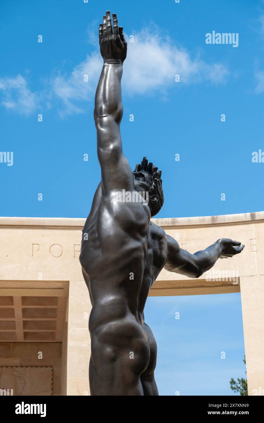 American cemetery statue at Normandy area. Skyward reach. WWII memorial ...