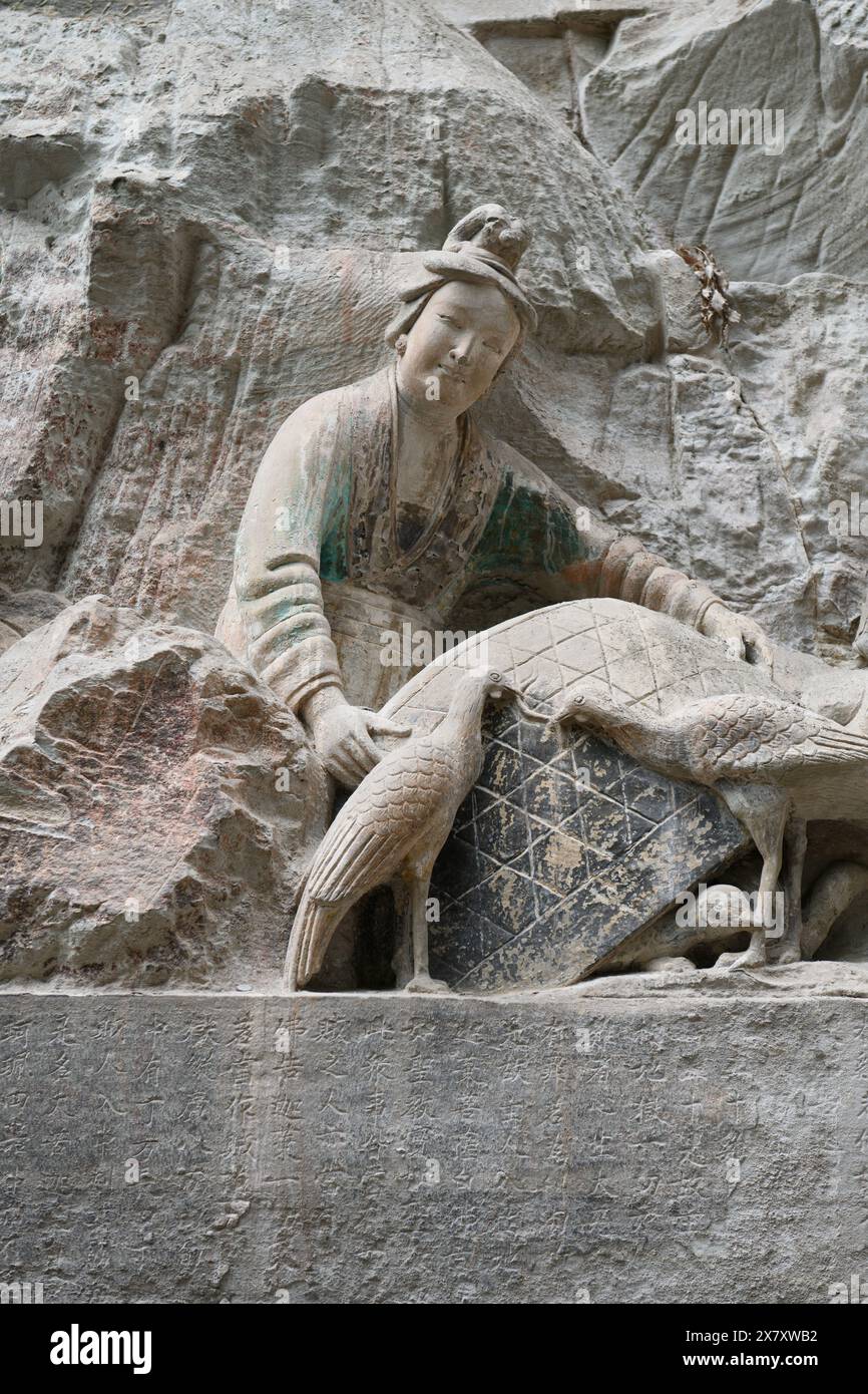 ncient Hillside Rock Carving, a woman is raising chickens - Dazu ...
