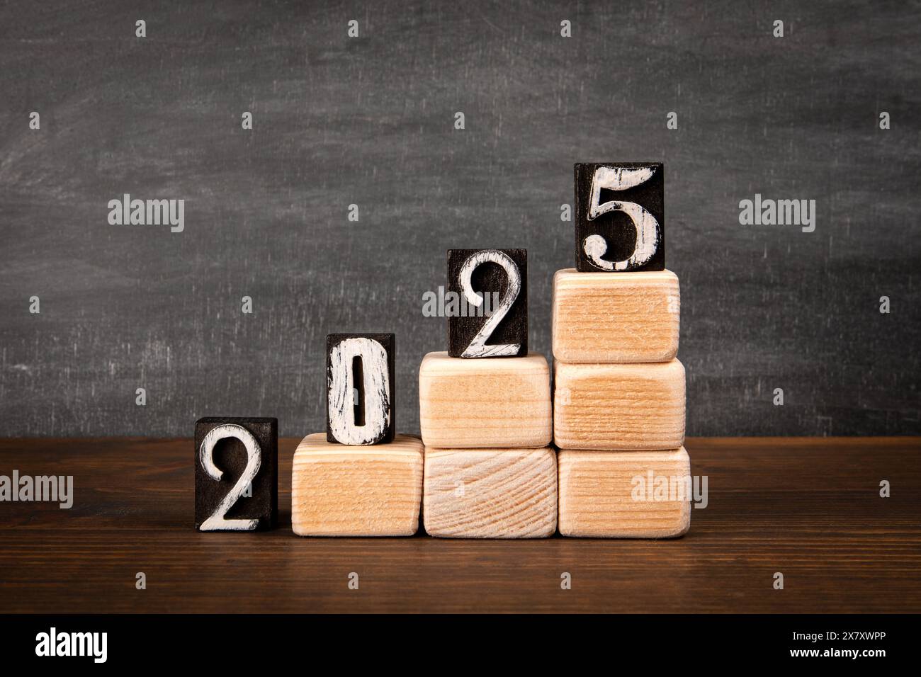 2025 goals. Alphabet blocks on wooden texture table. Development and ...