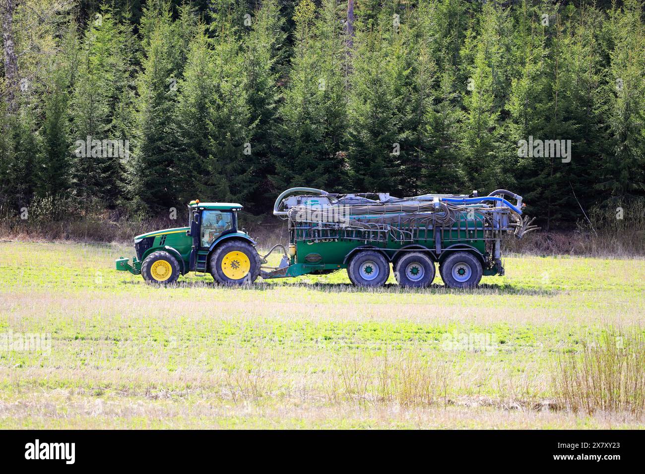John Deere 7230R tractor and Samson PG slurry tanker in stubble field ...